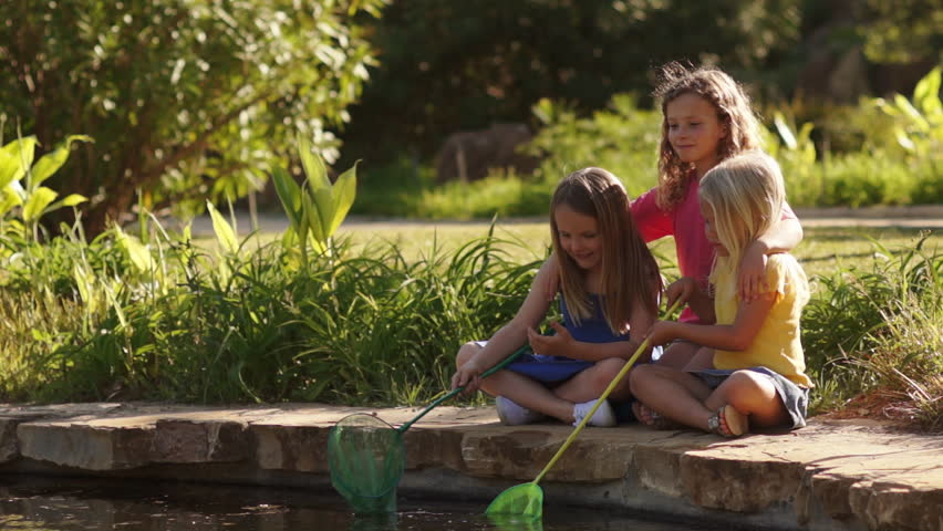 Stock video of three children playing with fishing nets | 8202496 ...