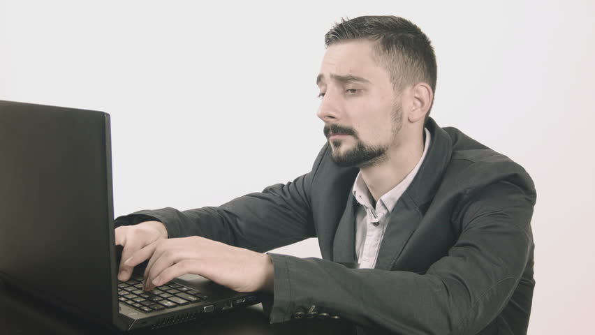 Stock video of bored businessman typing at his desk | 8493946 ...