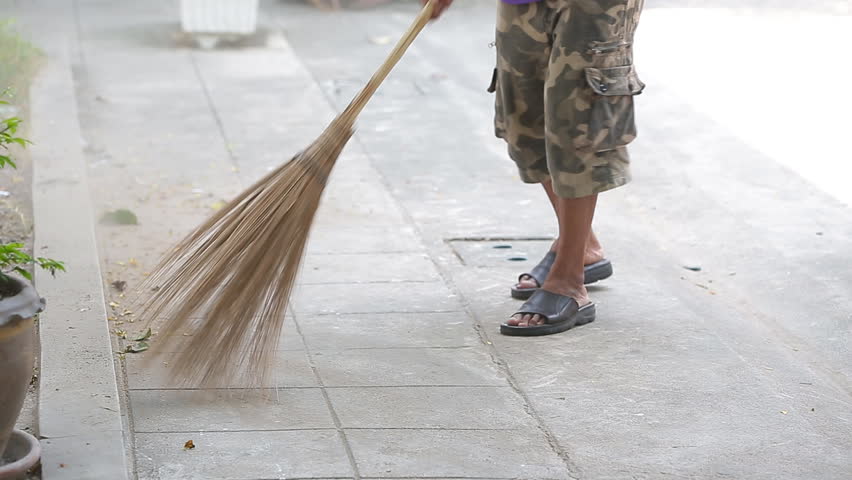 Man Sweeping Ground with a Stock Footage Video (100% Royalty-free ...