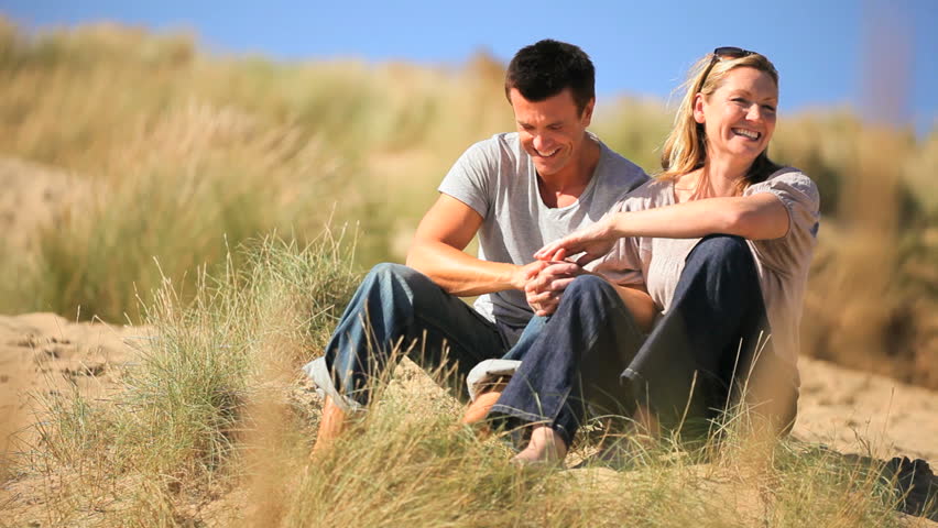 Stock Video Clip of Attractive young caucasian couple enjoying quiet ...