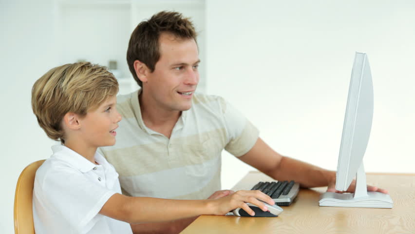 Stock video of father and son on the computer | 927376 | Shutterstock