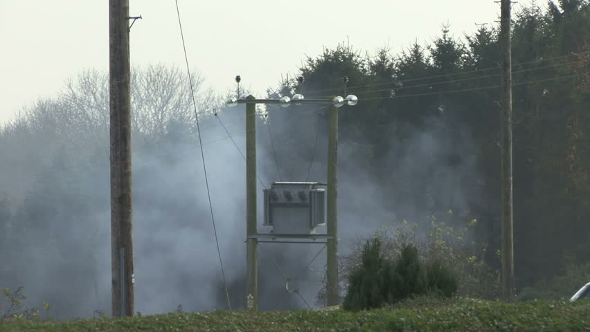 Smoke Rises Behind A High Voltage Electricity Transformer. Vídeo stock ...