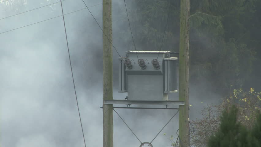 Smoke Rises Behind A High Voltage Electricity Transformer. Vídeo stock ...