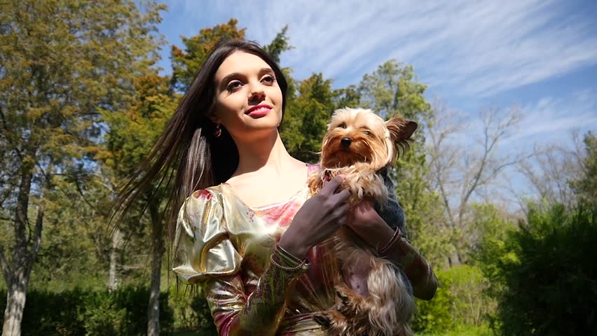 Beautiful Brunette Girl With Little Pet Dog Have Fun Posing In Park ...